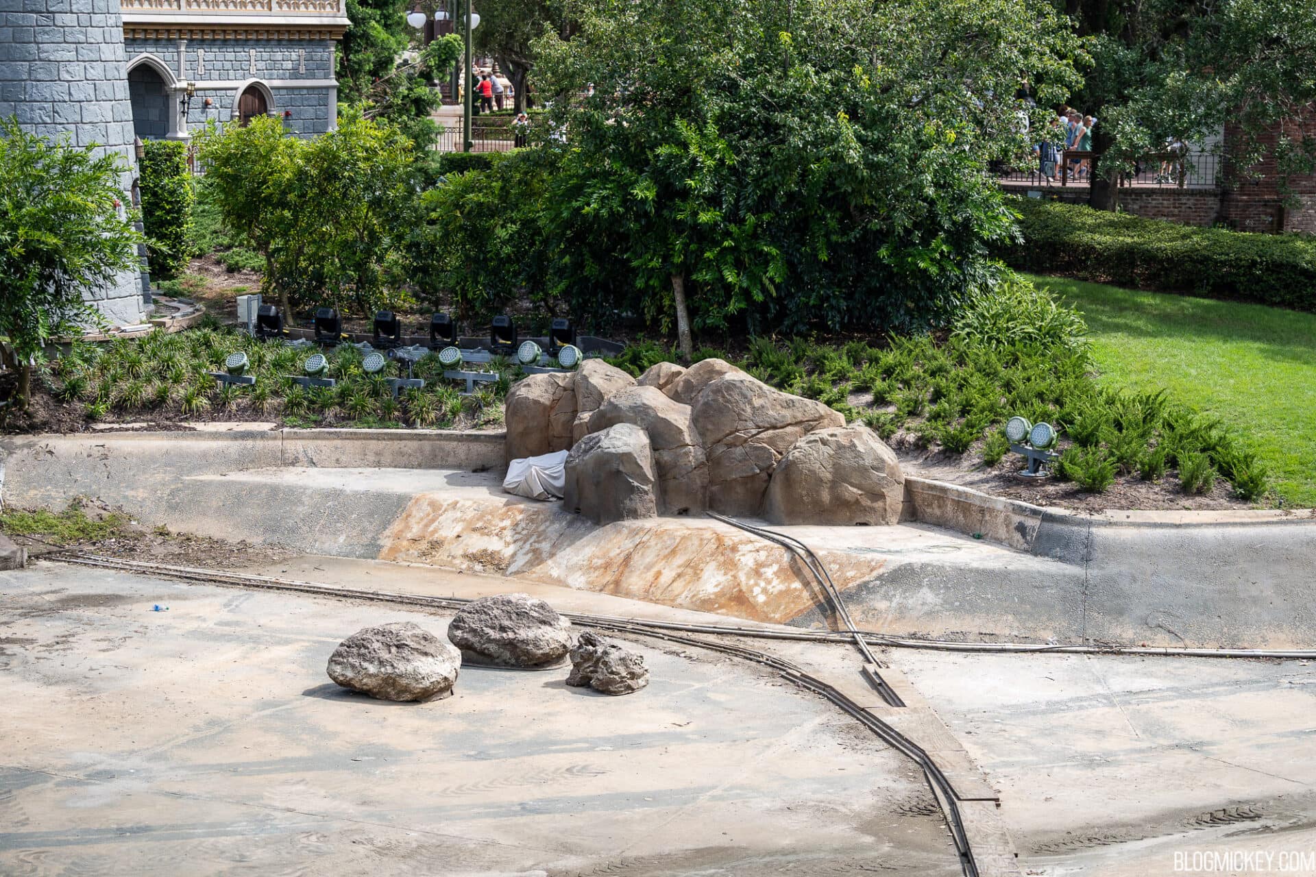 Damaged Rockwork Rebuilt in Cinderella Castle Moat Before Refilling