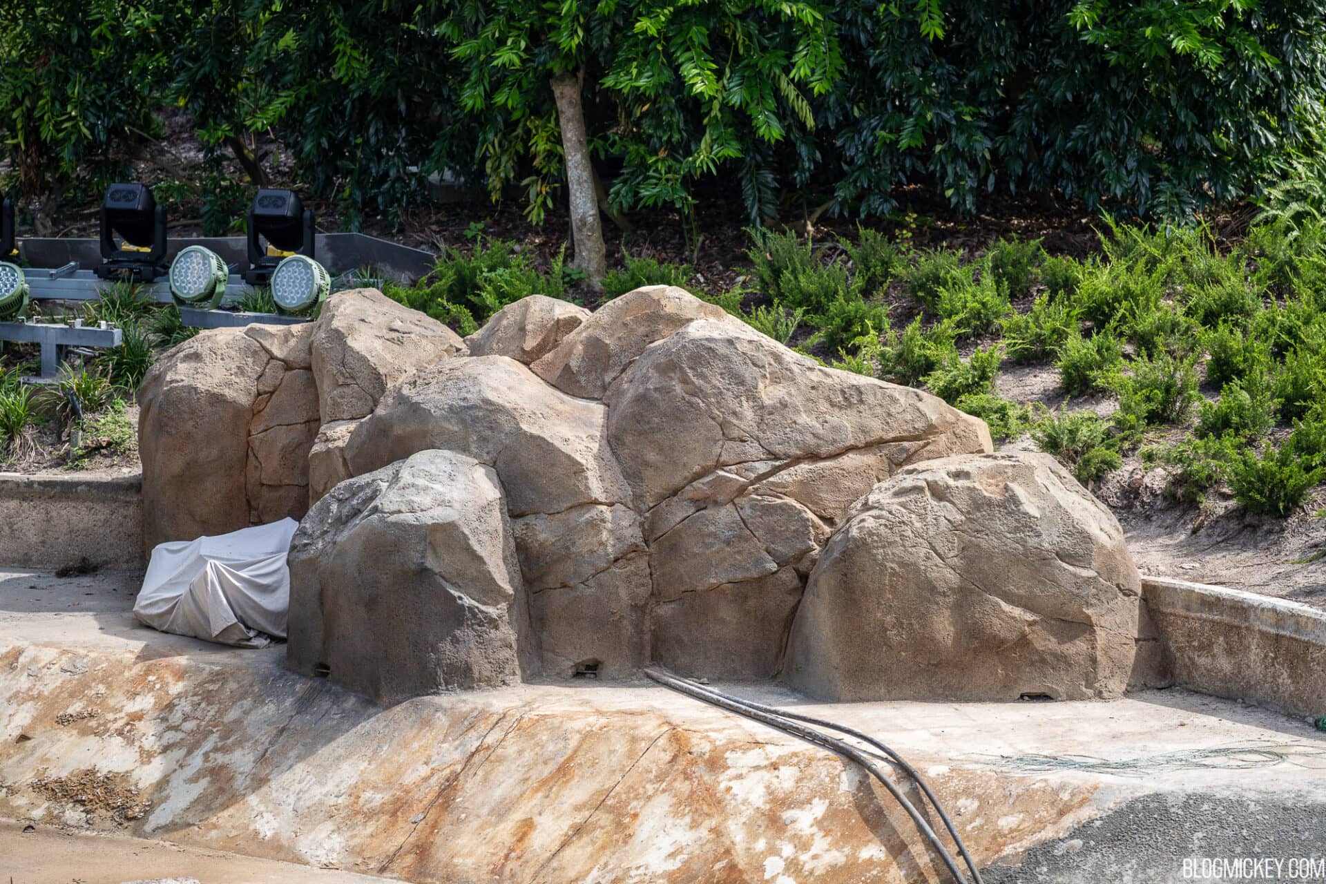 Damaged Rockwork Rebuilt in Cinderella Castle Moat Before Refilling